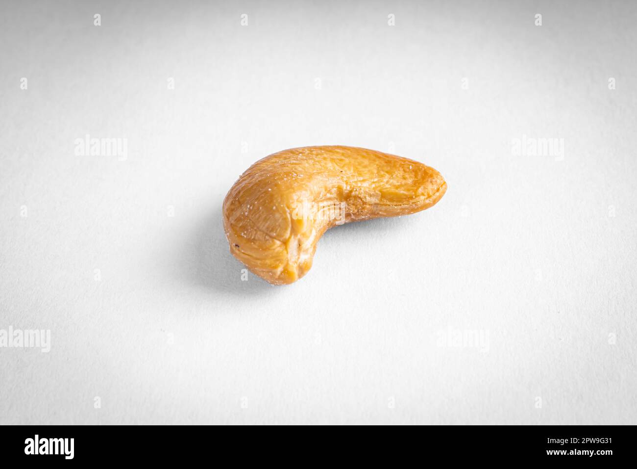 One cashew nut on white background Stock Photo - Alamy
