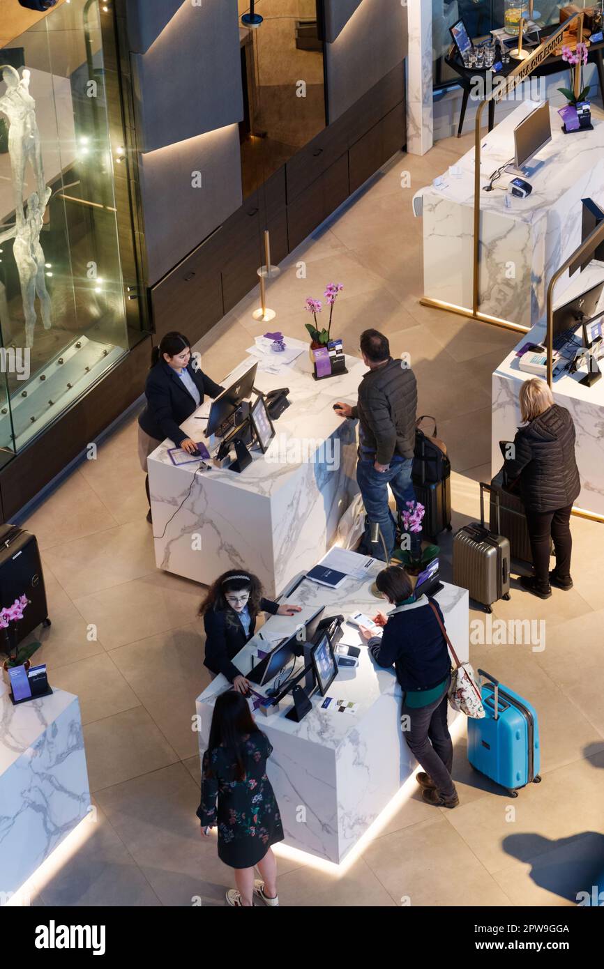 High top of view of customers waiting in a line queuing for the ...