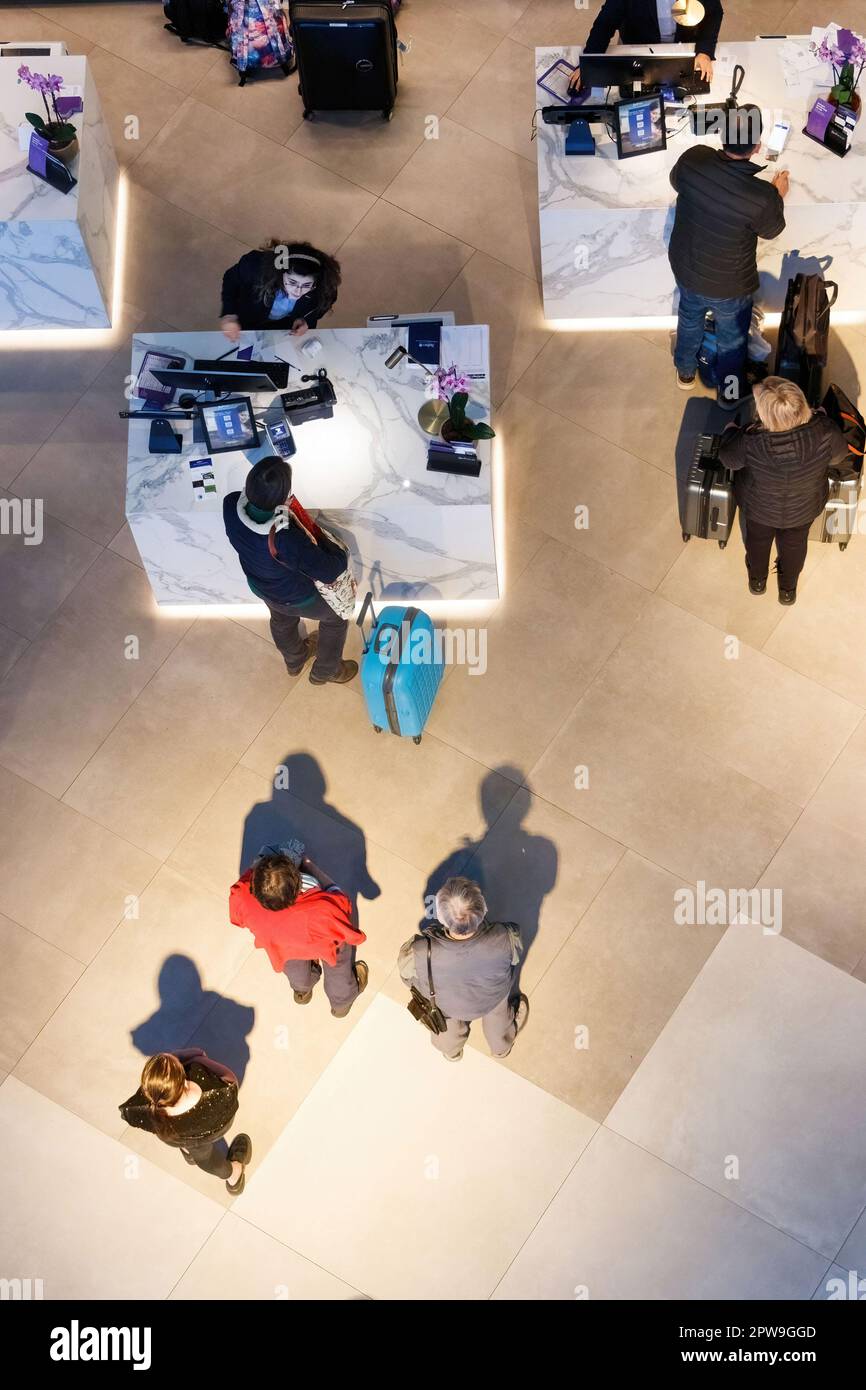 High top of view of customers waiting in a line queuing for the ...