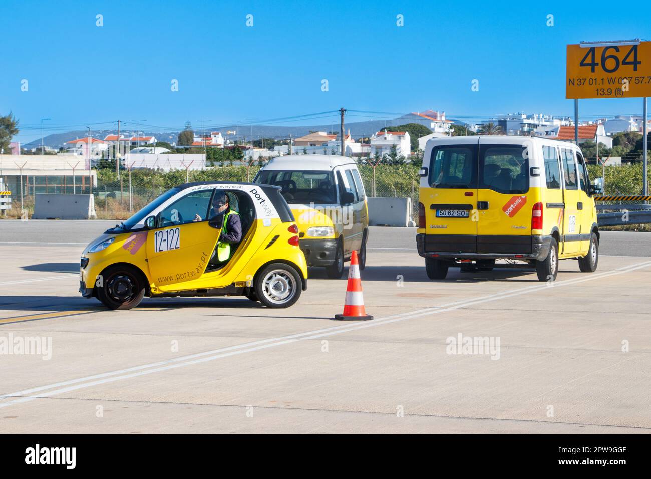 portway livery airport service vehicles on the apron at faro airport ...