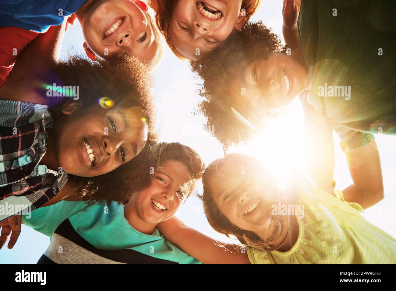 Embracing our differences. Portrait of a group of diverse and happy ...