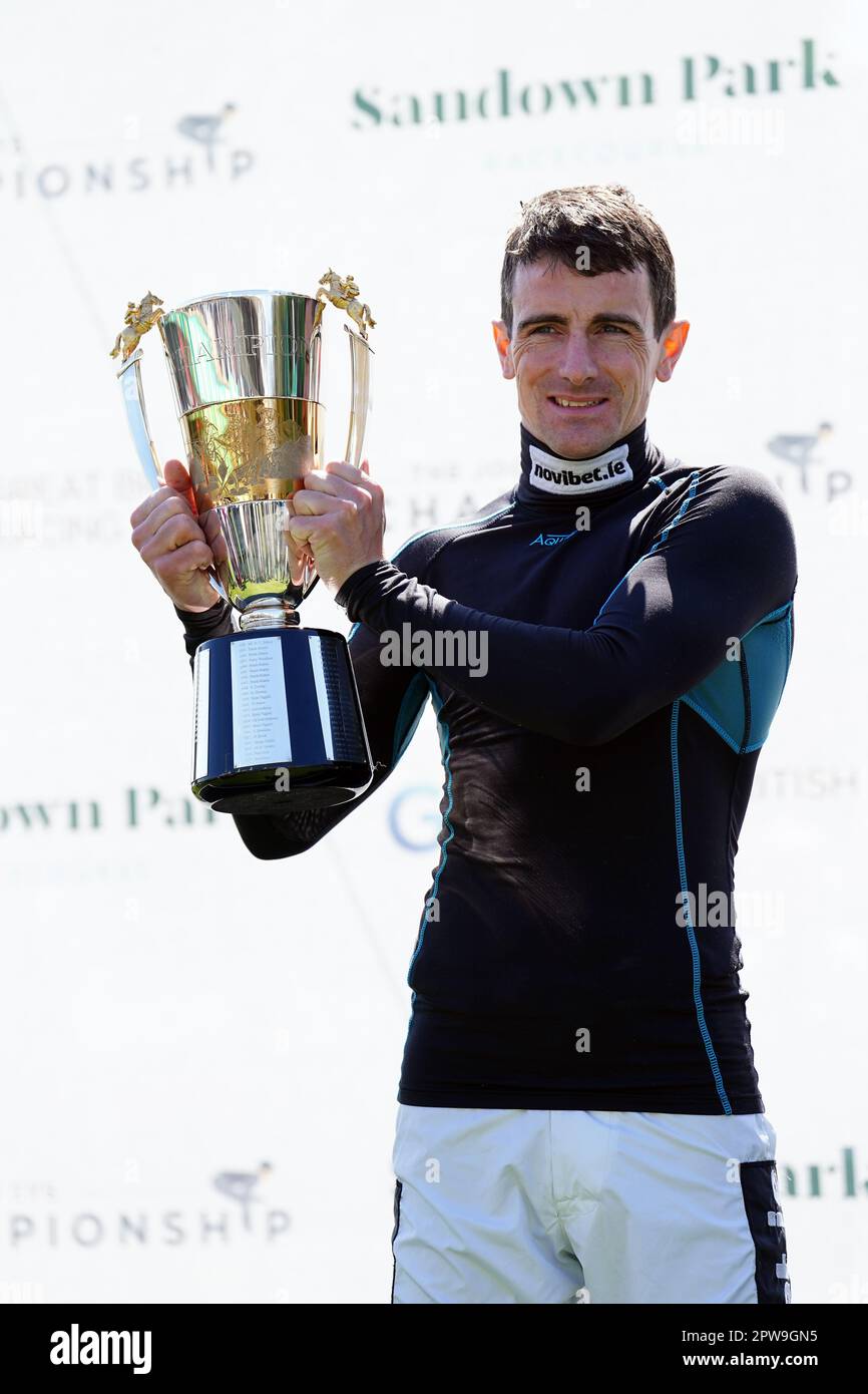Brian Hughes with the Champion Jockey trophy at Sandown Park Racecourse ...