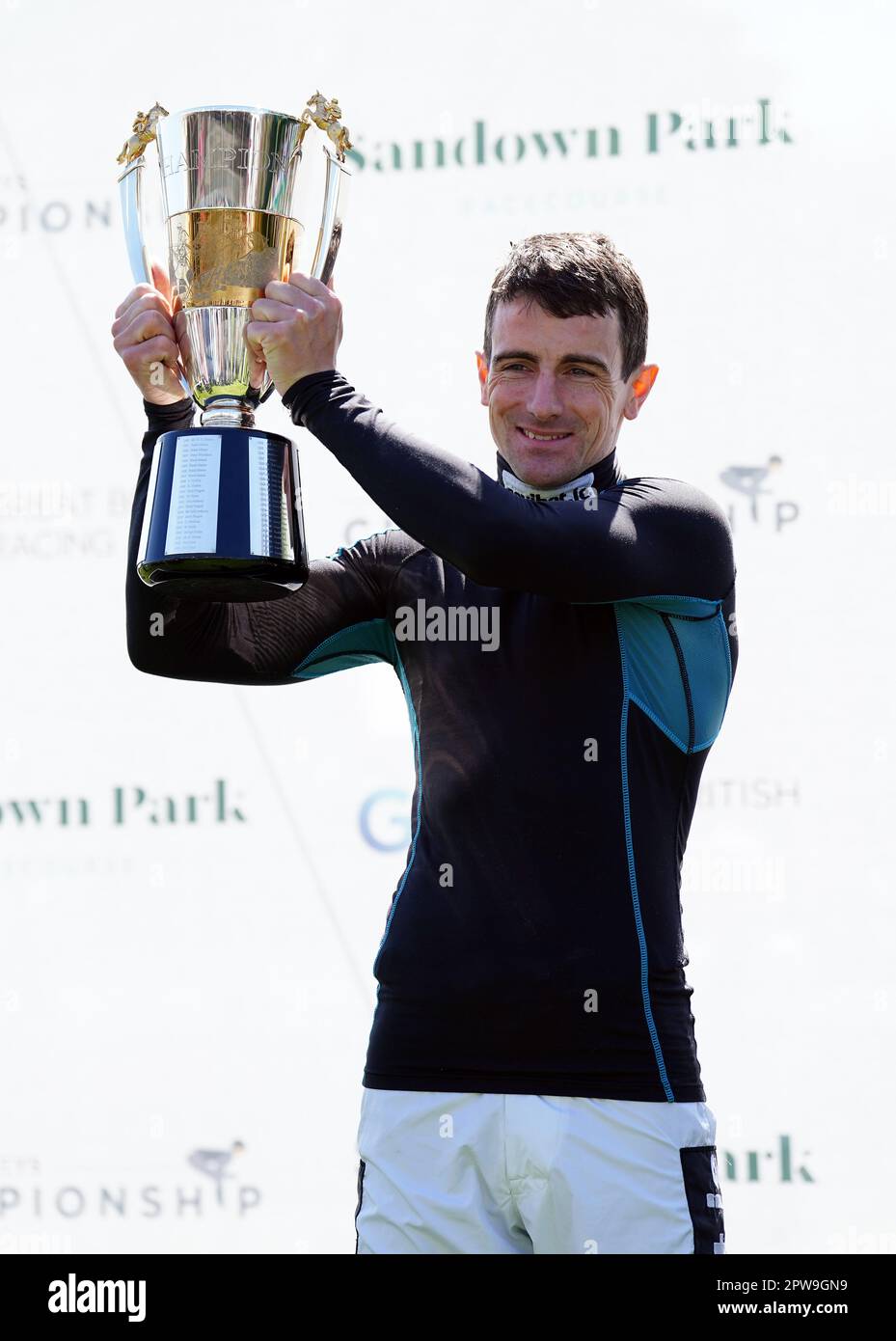 Brian Hughes with the Champion Jockey trophy at Sandown Park Racecourse ...