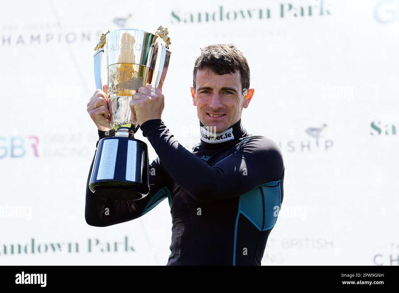 Brian Hughes with the Champion Jockey trophy at Sandown Park Racecourse ...
