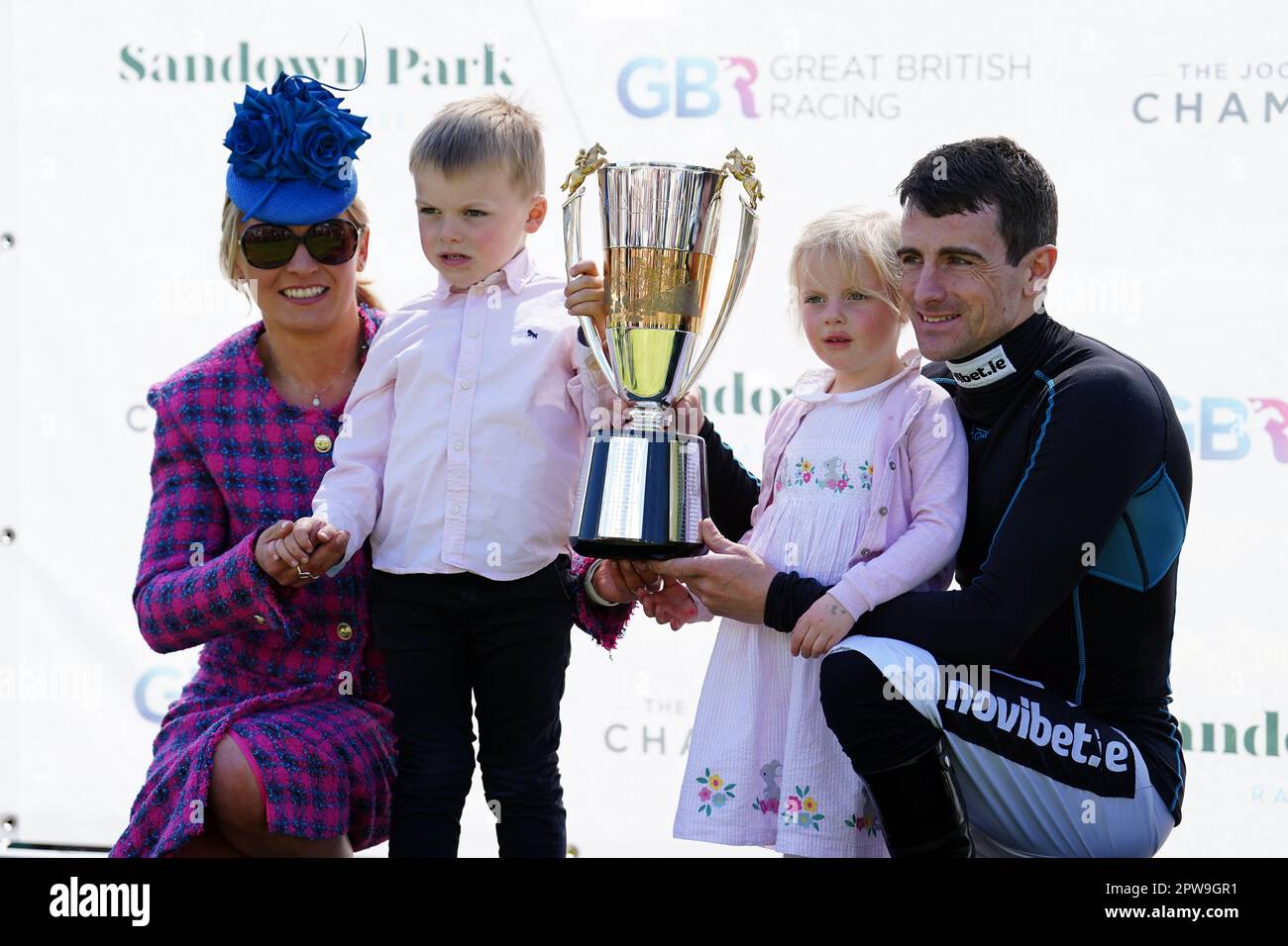Brian Hughes with the Champion Jockey trophy at Sandown Park Racecourse ...