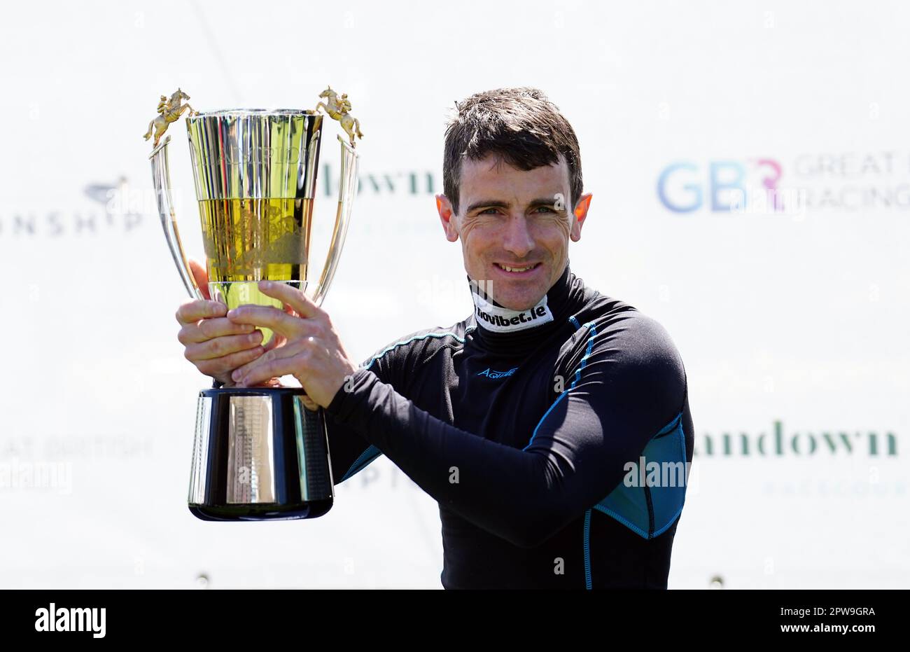 Brian Hughes with the Champion Jockey trophy at Sandown Park Racecourse ...