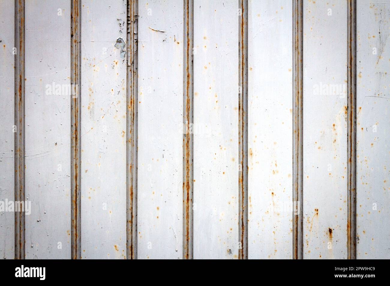 Old rusty metal warehouse wall texture background. Close up of rough ...