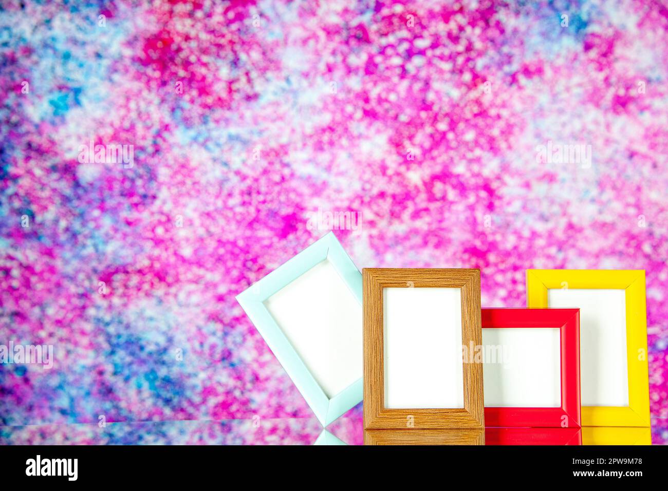 front view beautiful picture frames with colored corners on light pink ...