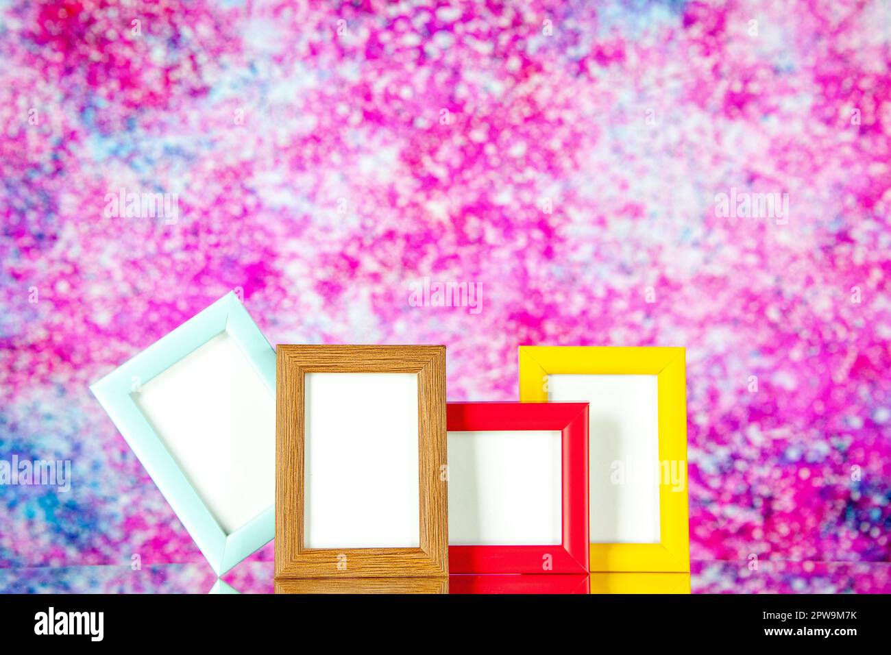 front view beautiful picture frames with colored corners on light pink ...