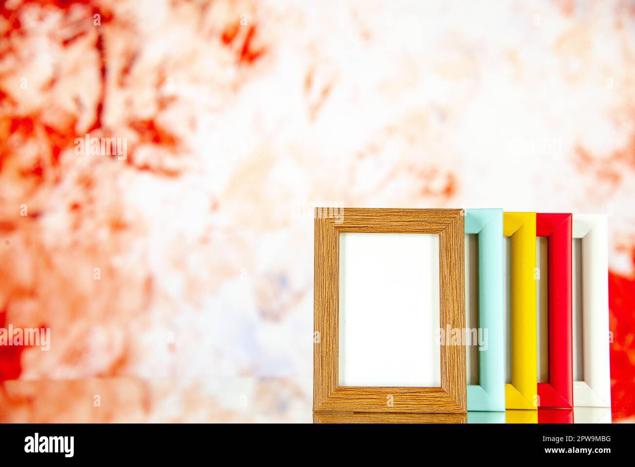 front view different picture frames with colored corners on a light ...