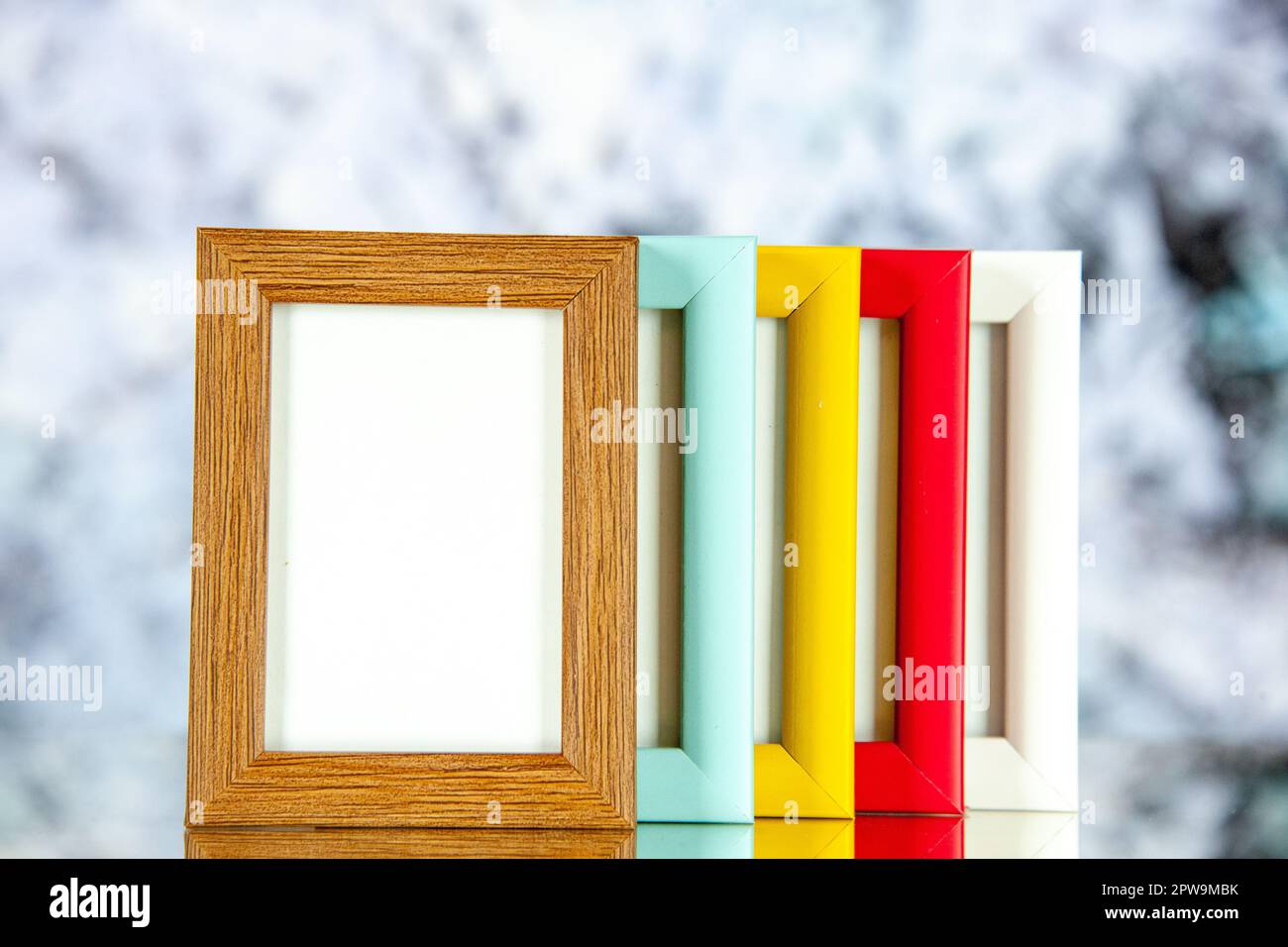 front view different picture frames with colored corners on a light ...
