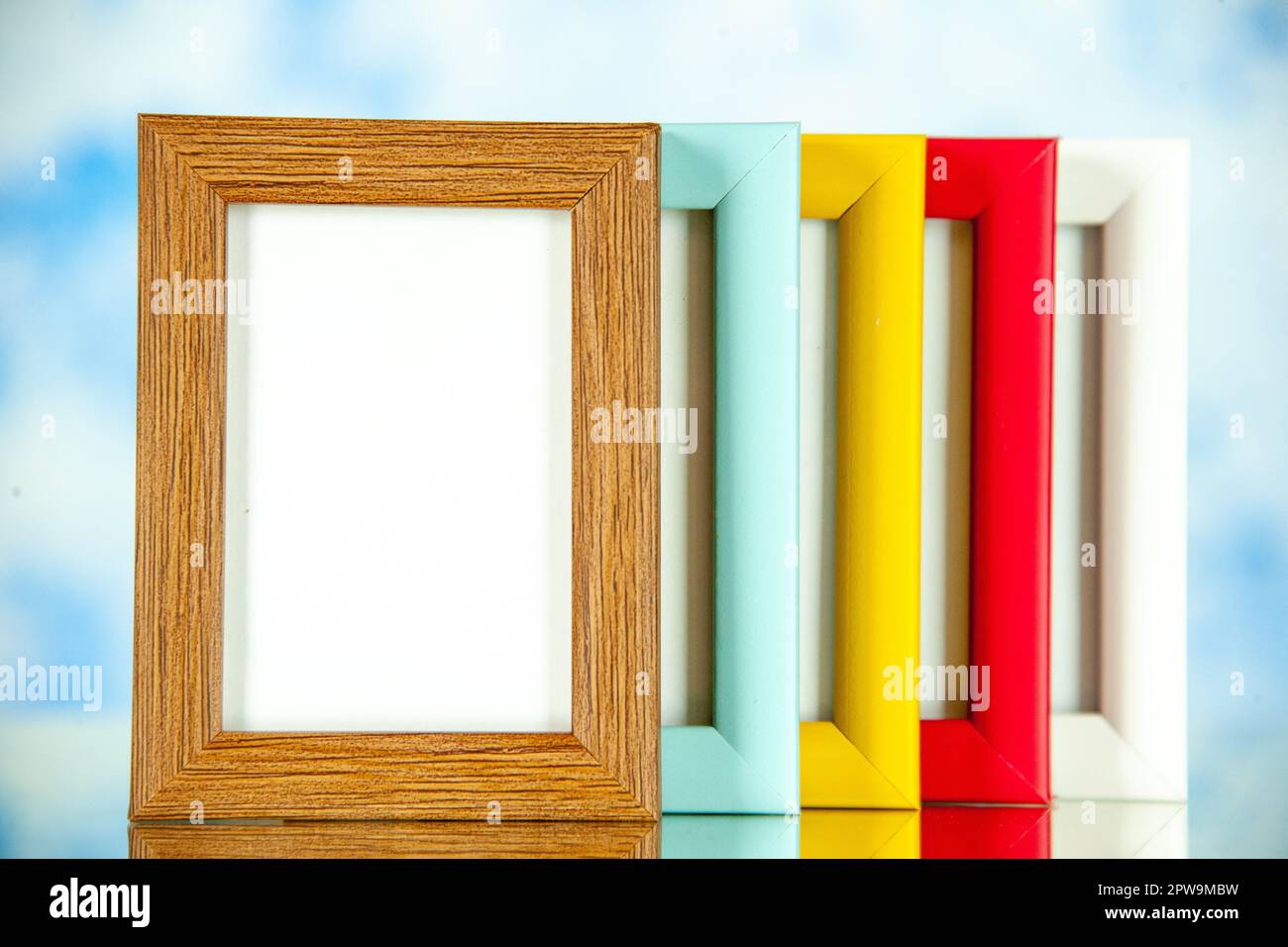 front view different picture frames with colored corners on a light ...