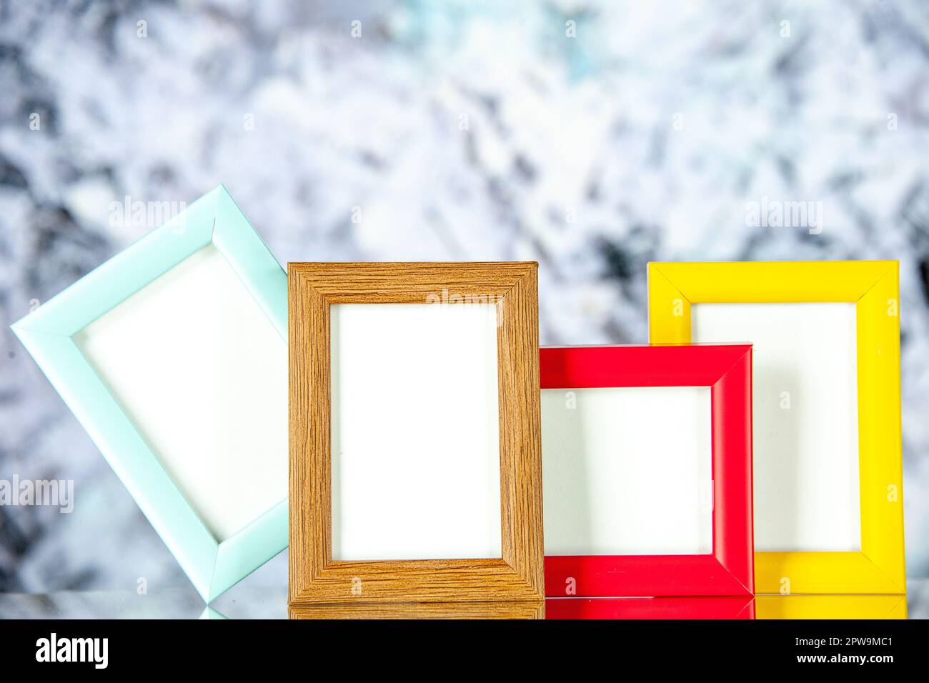 front view different picture frames with colored corners on a light ...