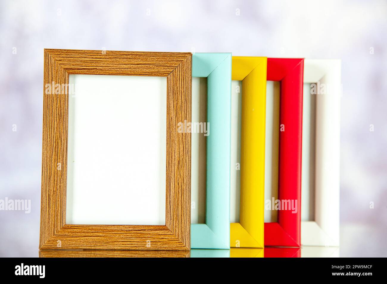 front view different picture frames with colored corners on a light ...