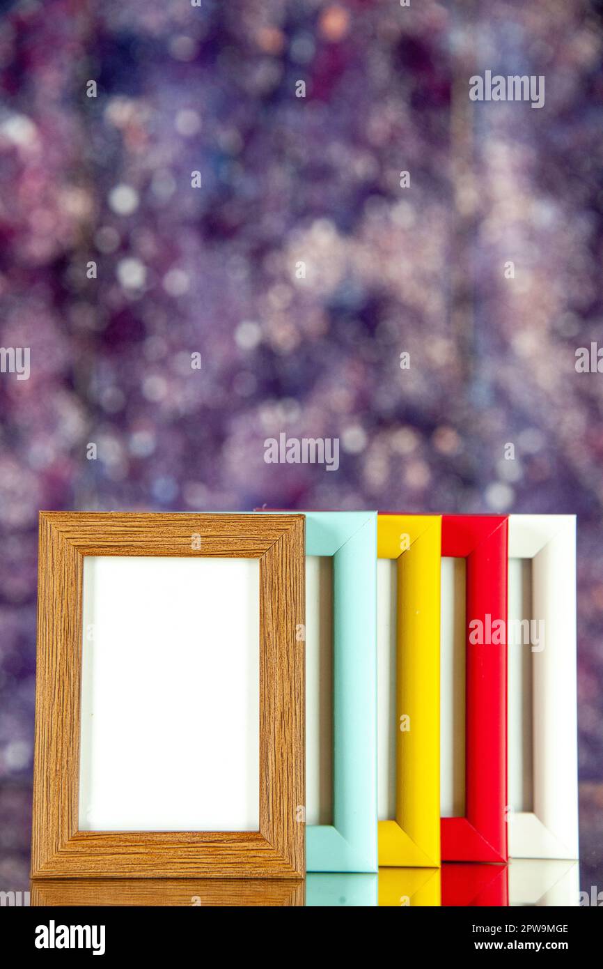 front view different picture frames with colored corners on bright ...