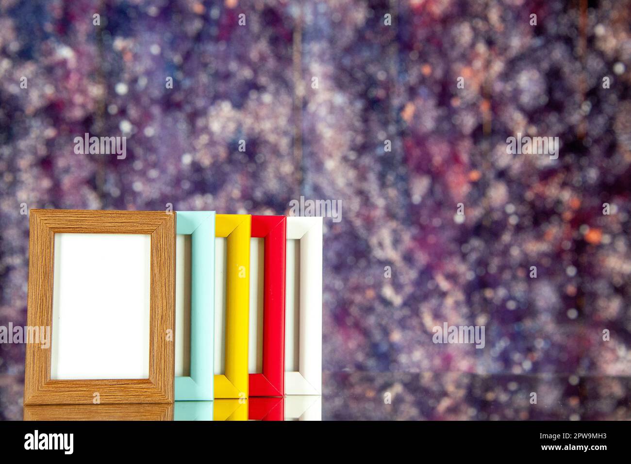 front view different picture frames with colored corners on bright ...