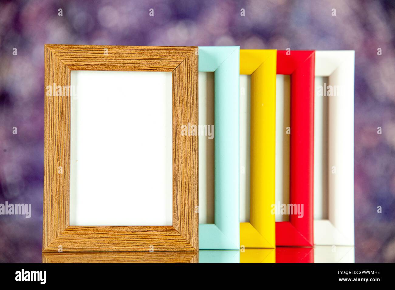 front view different picture frames with colored corners on bright ...