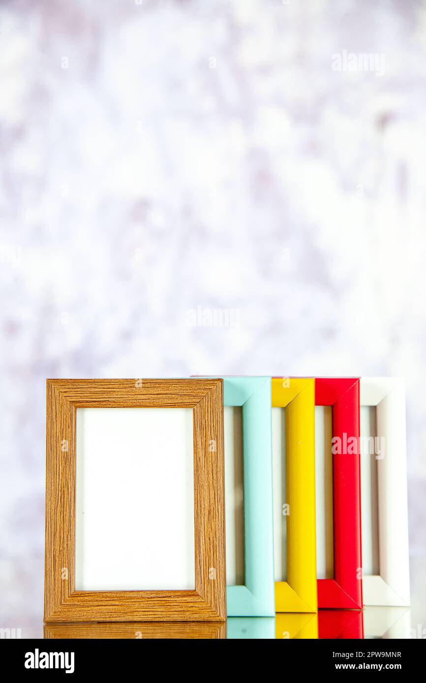 front view different picture frames with colored corners on light ...