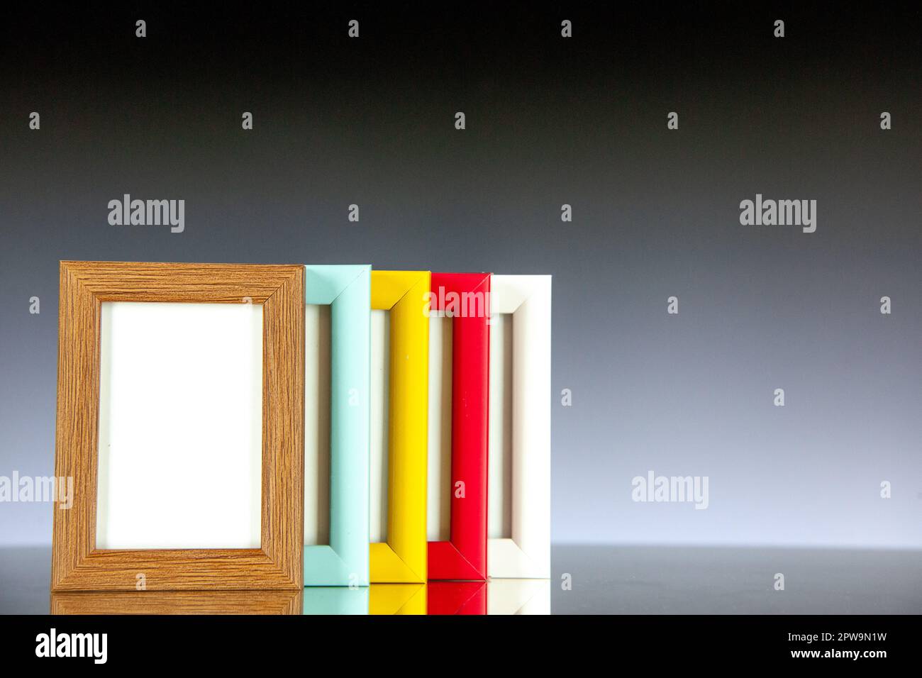 front view different picture frames with colored corners on light dark ...