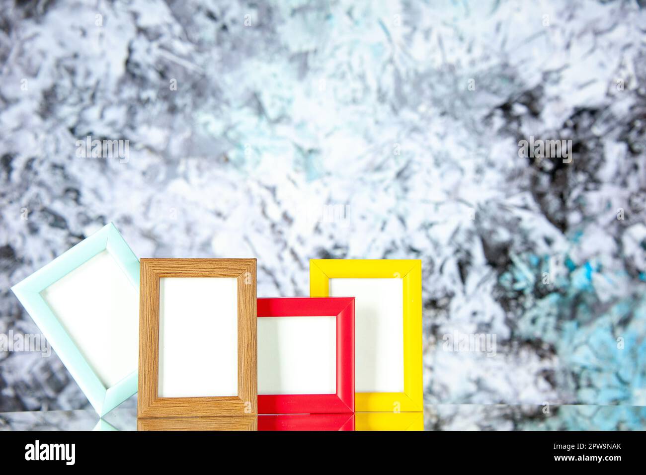 front view different picture frames with colored corners on the light ...