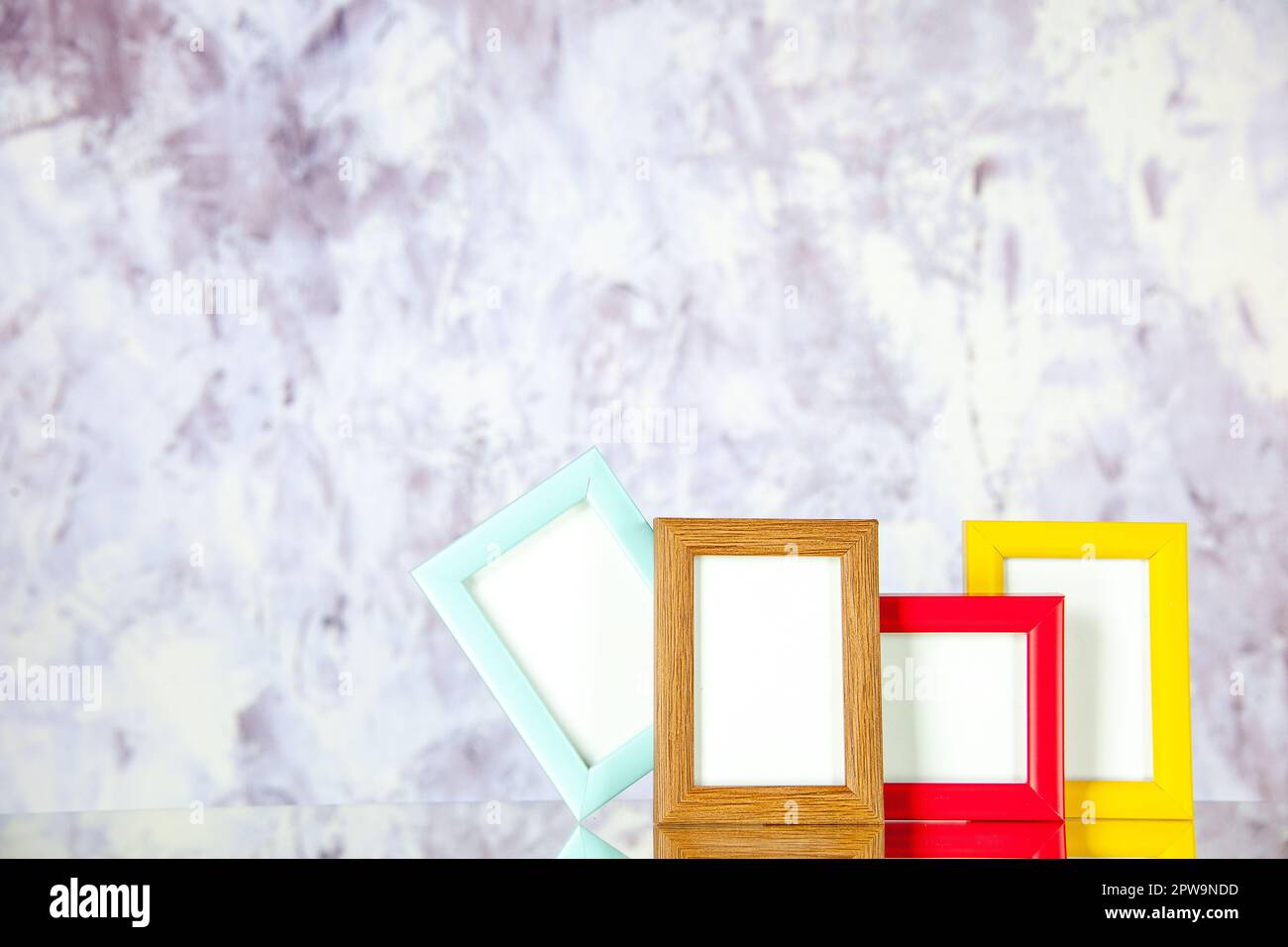 front view different picture frames with colored corners on white ...