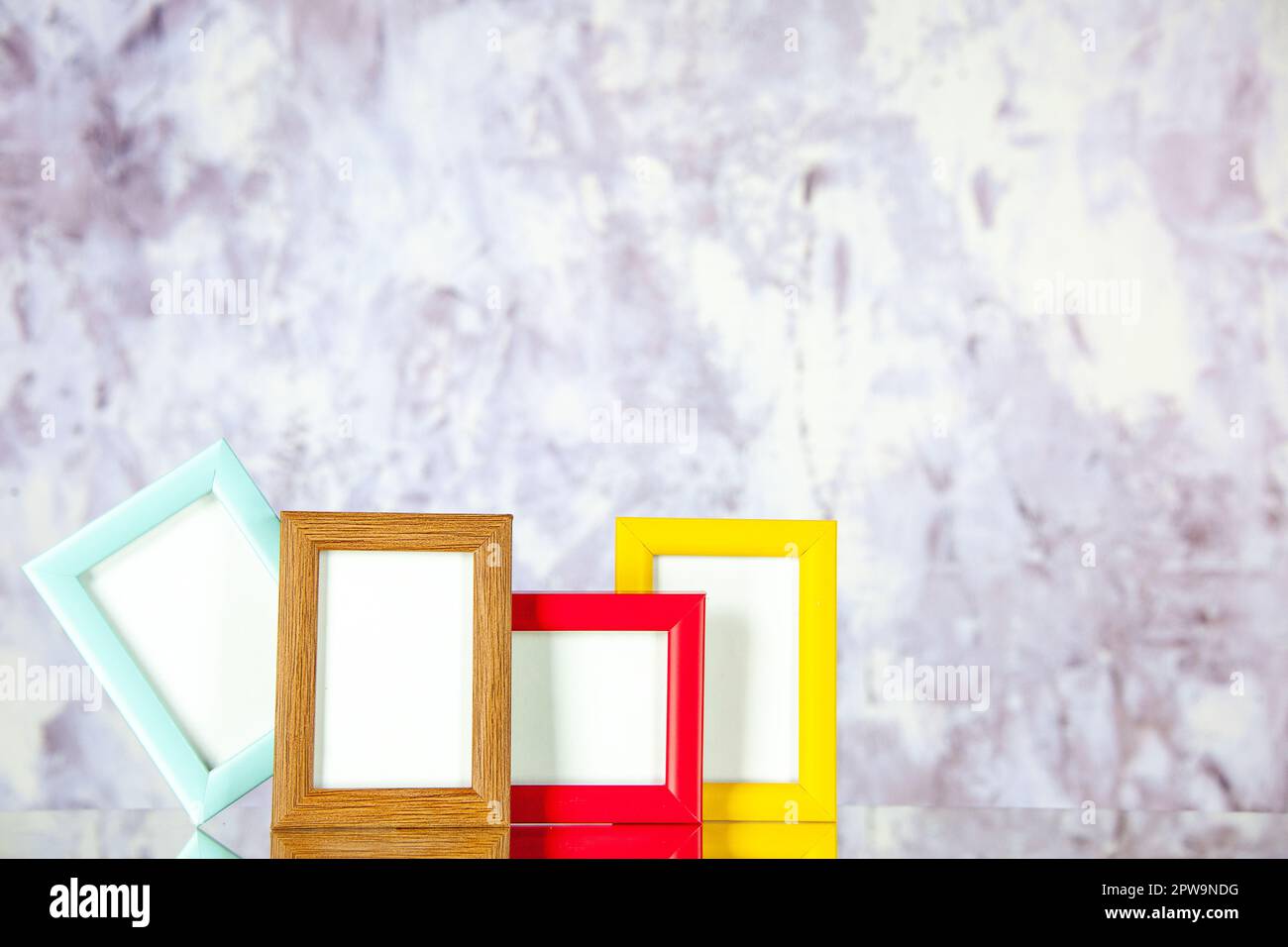 front view different picture frames with colored corners on white ...