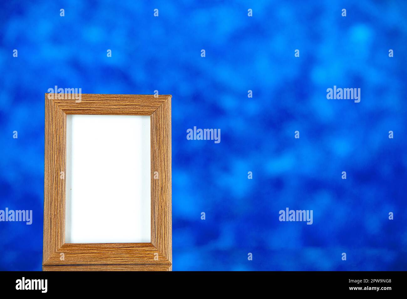 front view elegant picture frame on blue background color present ...