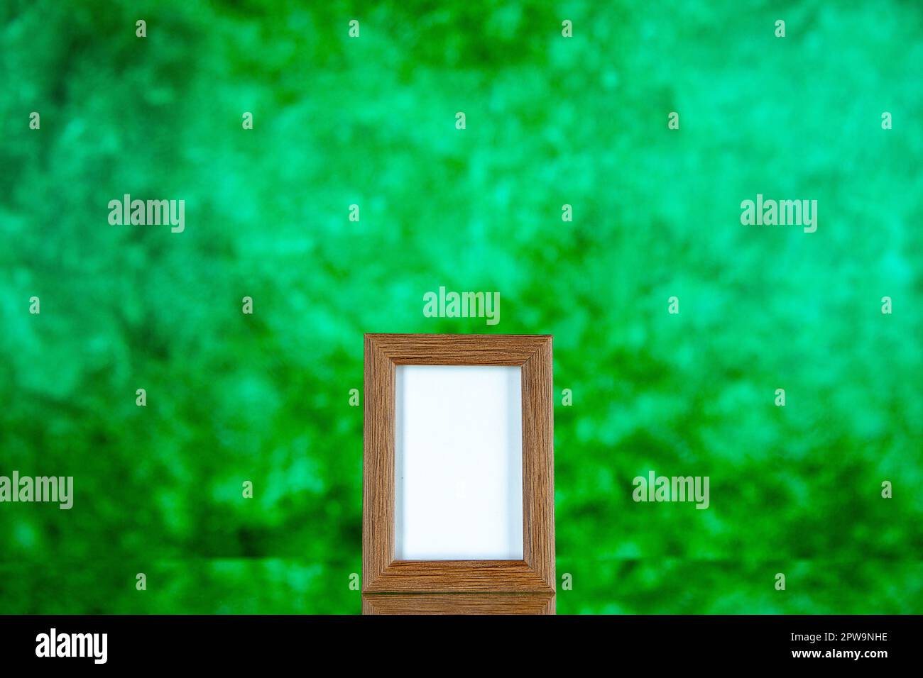 front view elegant picture frame on green background color present gift ...