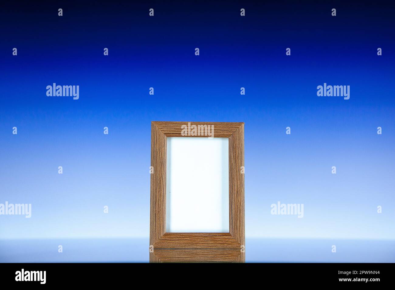 front view elegant picture frame on light blue background color present ...