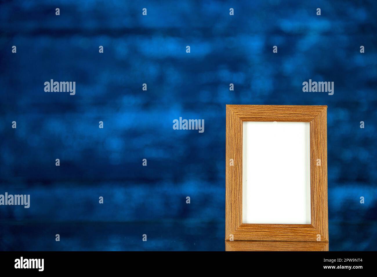 front view picture frame on blue background color shoot picture ...