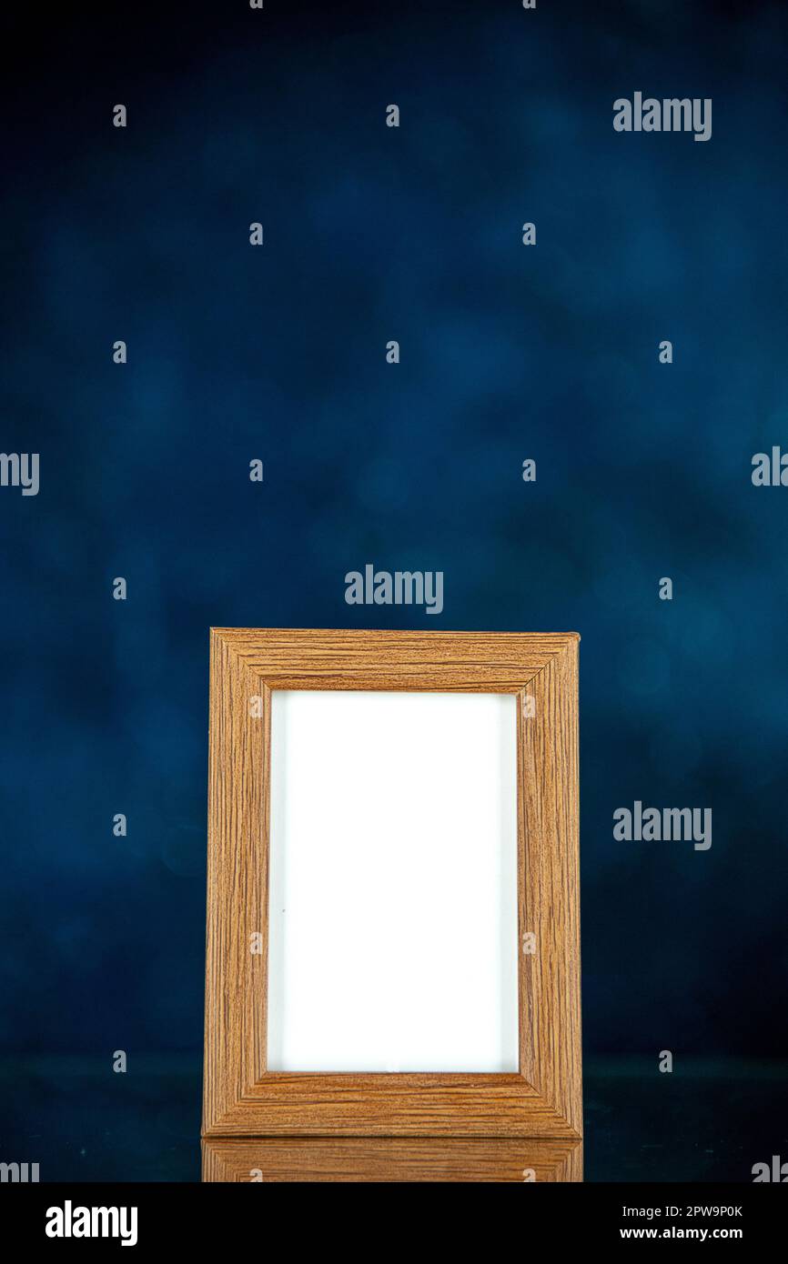 front view picture frame on dark-blue background portrait color present ...