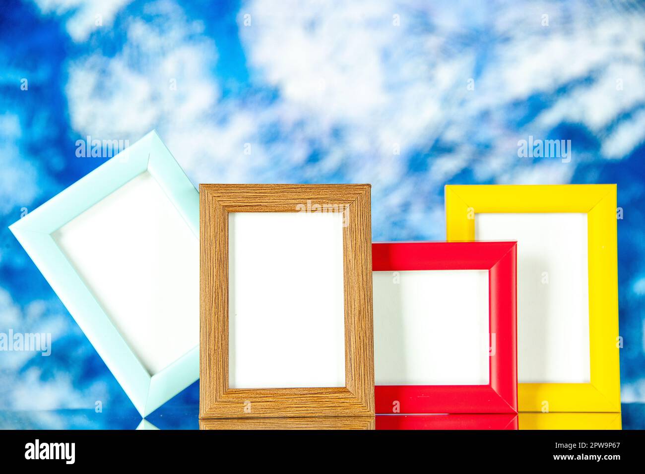 front view picture frames with colored corners on blue background ...
