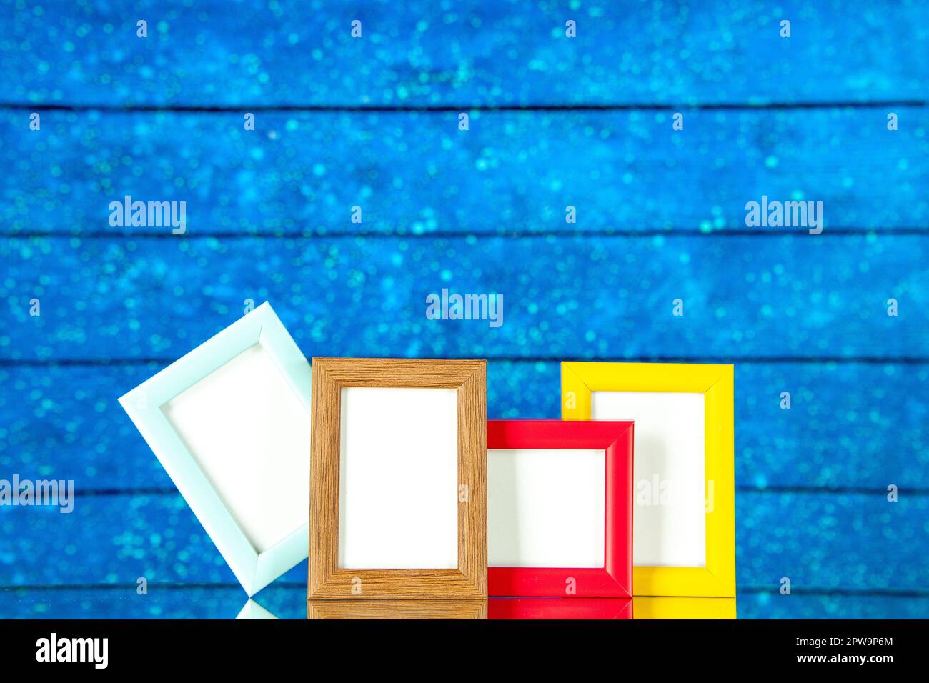 front view picture frames with colored corners on blue background ...