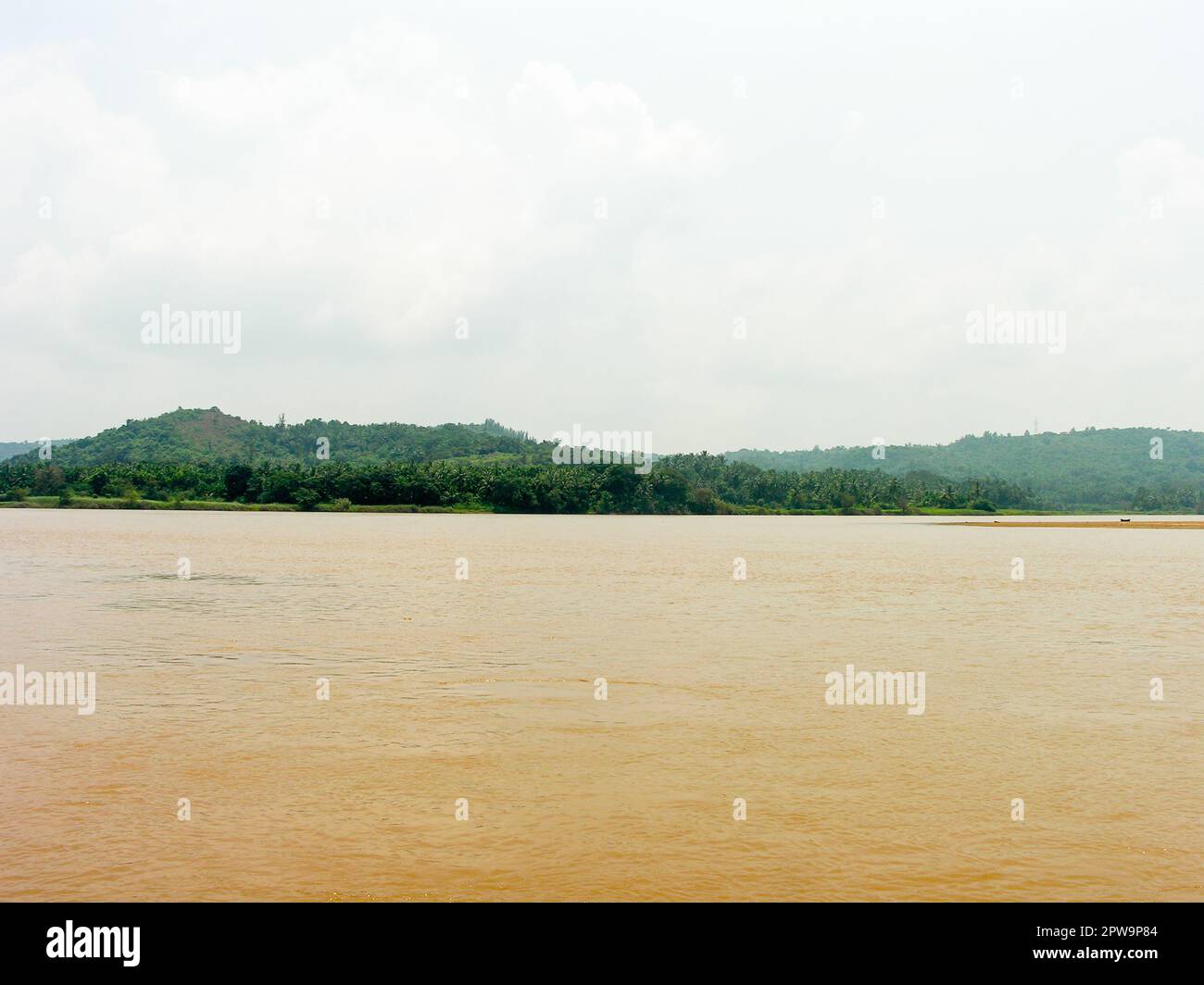 Flooded river with muddy water Stock Photo - Alamy