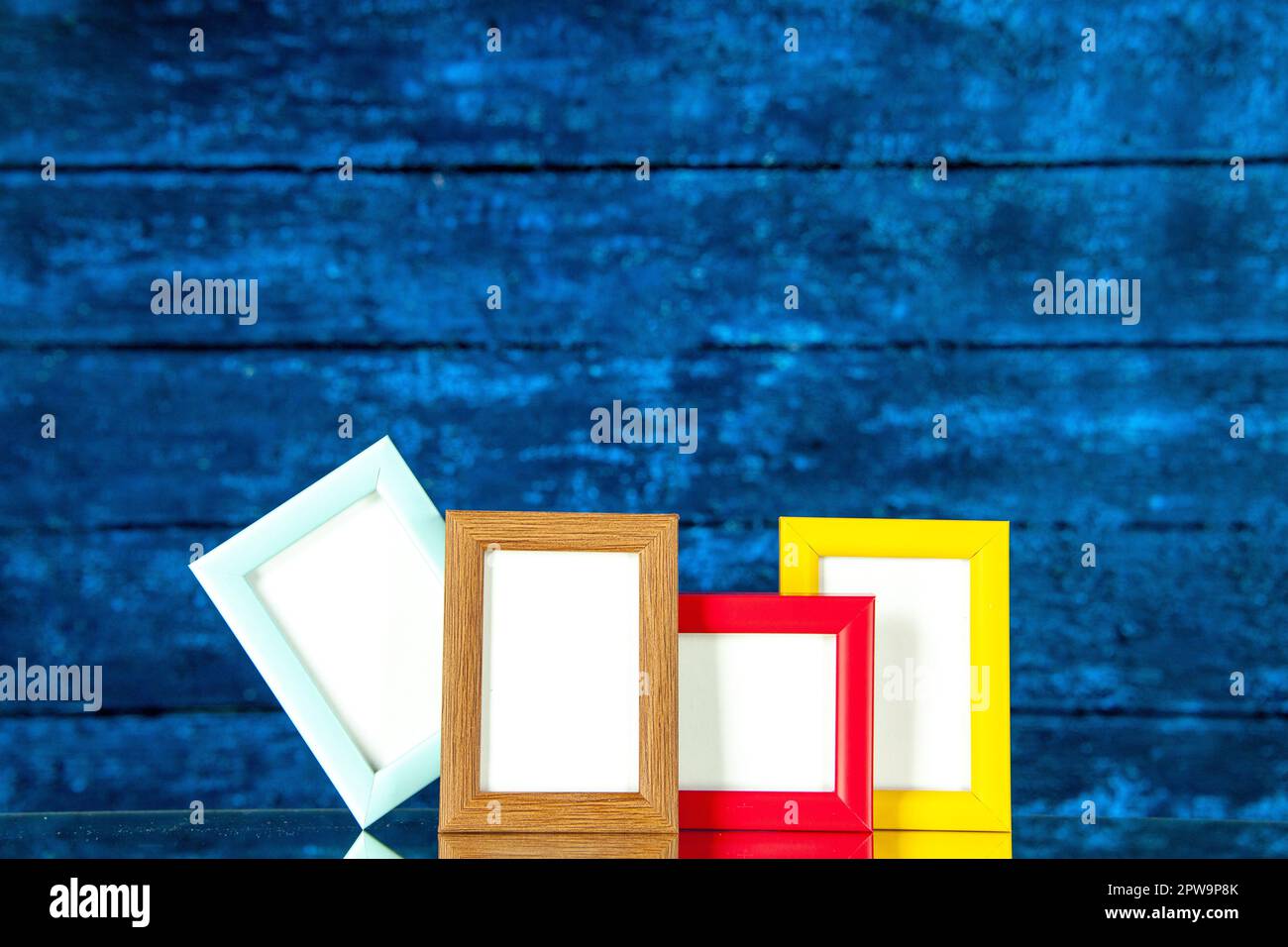 front view picture frames with colored corners on blue background ...
