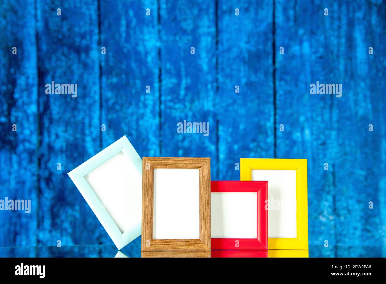 front view picture frames with colored corners on blue background ...