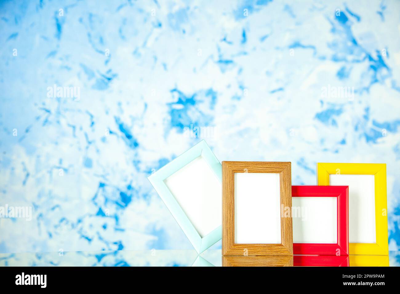 front view picture frames with colored corners on the light-blue ...
