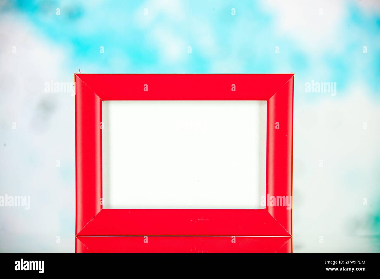 front view red picture frame on light blue background shoot family ...