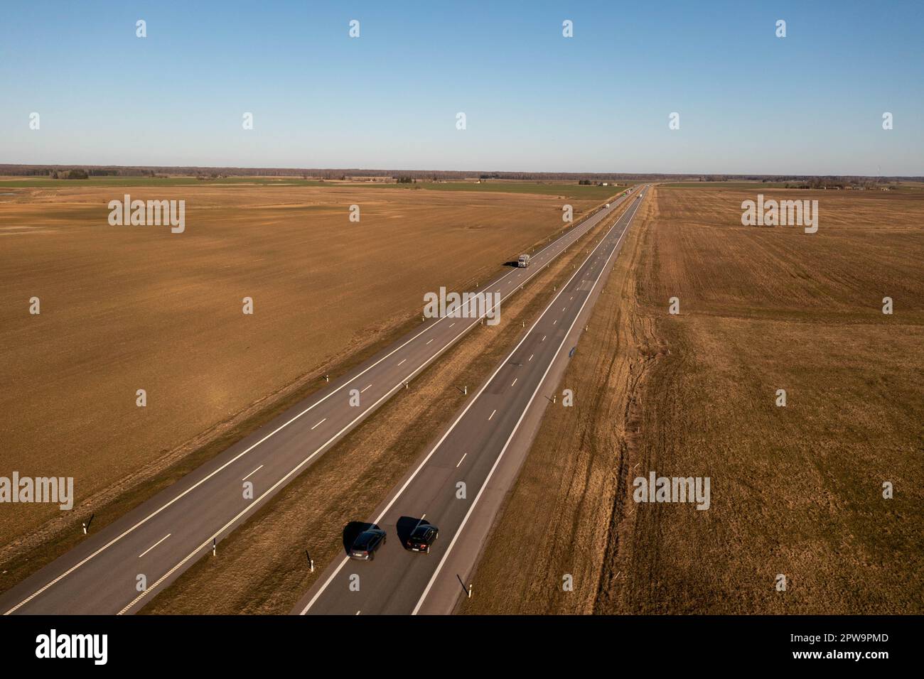 Drone photography of highway surrounded by agriculture fields and ...