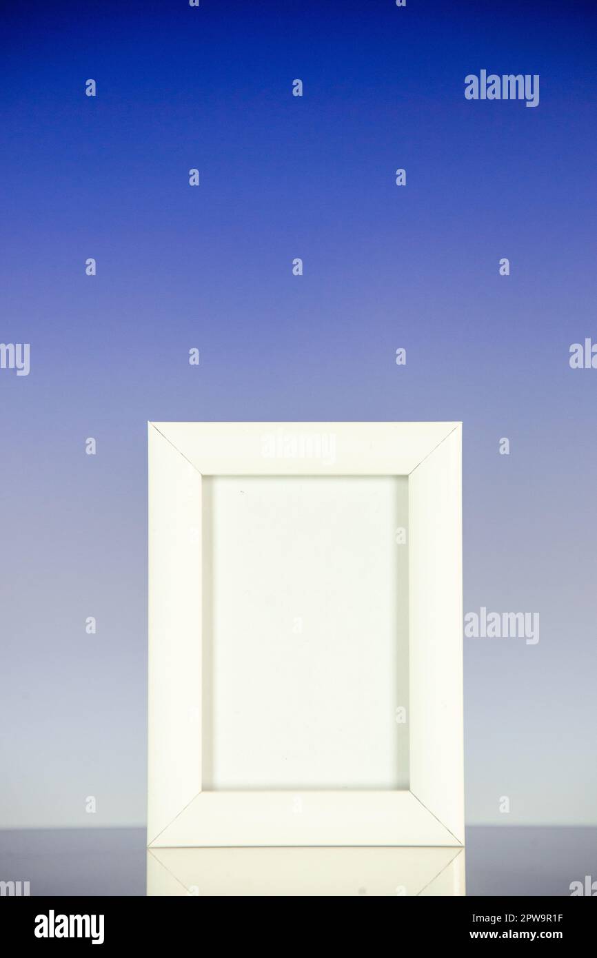 front view white picture frame on light blue background portrait family ...