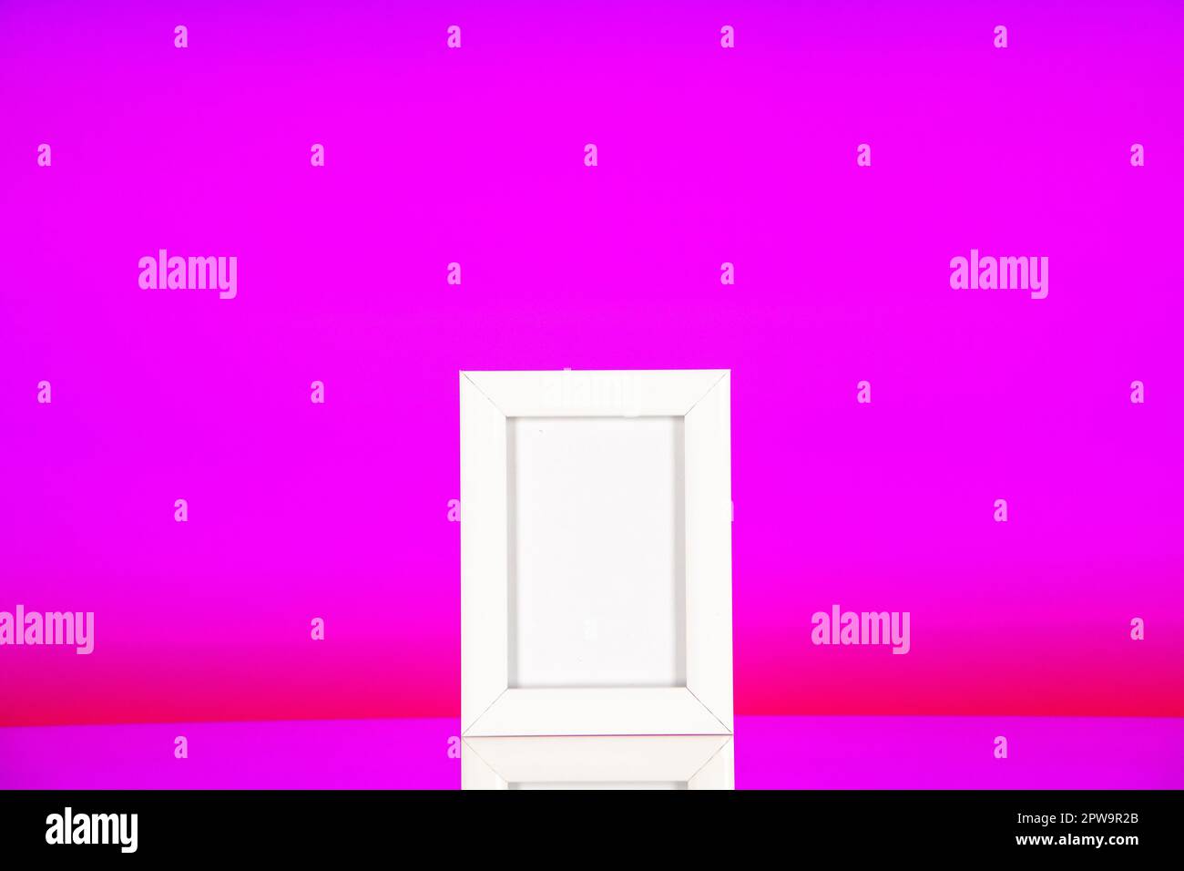 front view white picture frame on light pink background portrait family ...