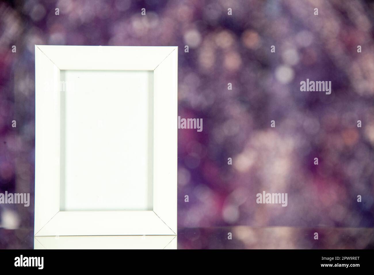 front view white picture frame on the bright purple background gift ...