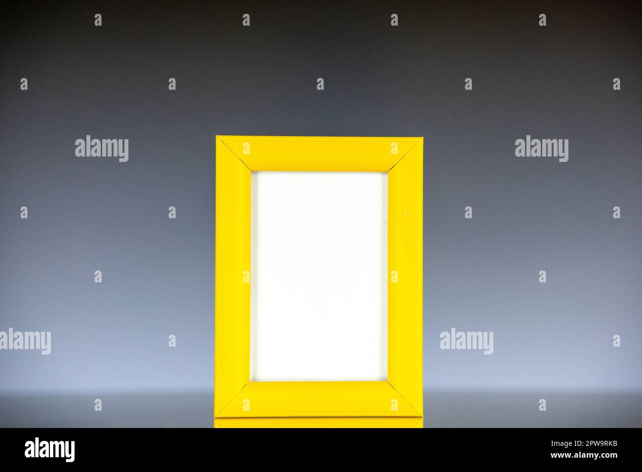 front view yellow picture frame on a dark background portrait family ...