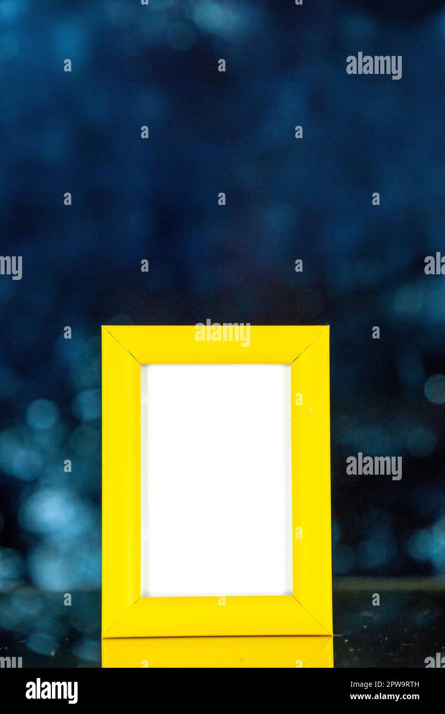 front view yellow picture frame on dark background color shoot picture ...
