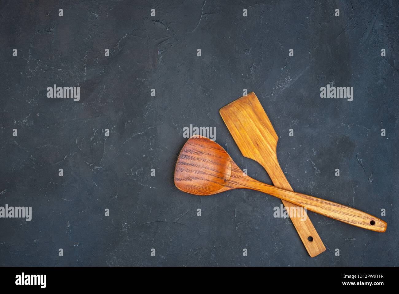 top view crossed wooden spoons on dark background copy place Stock ...