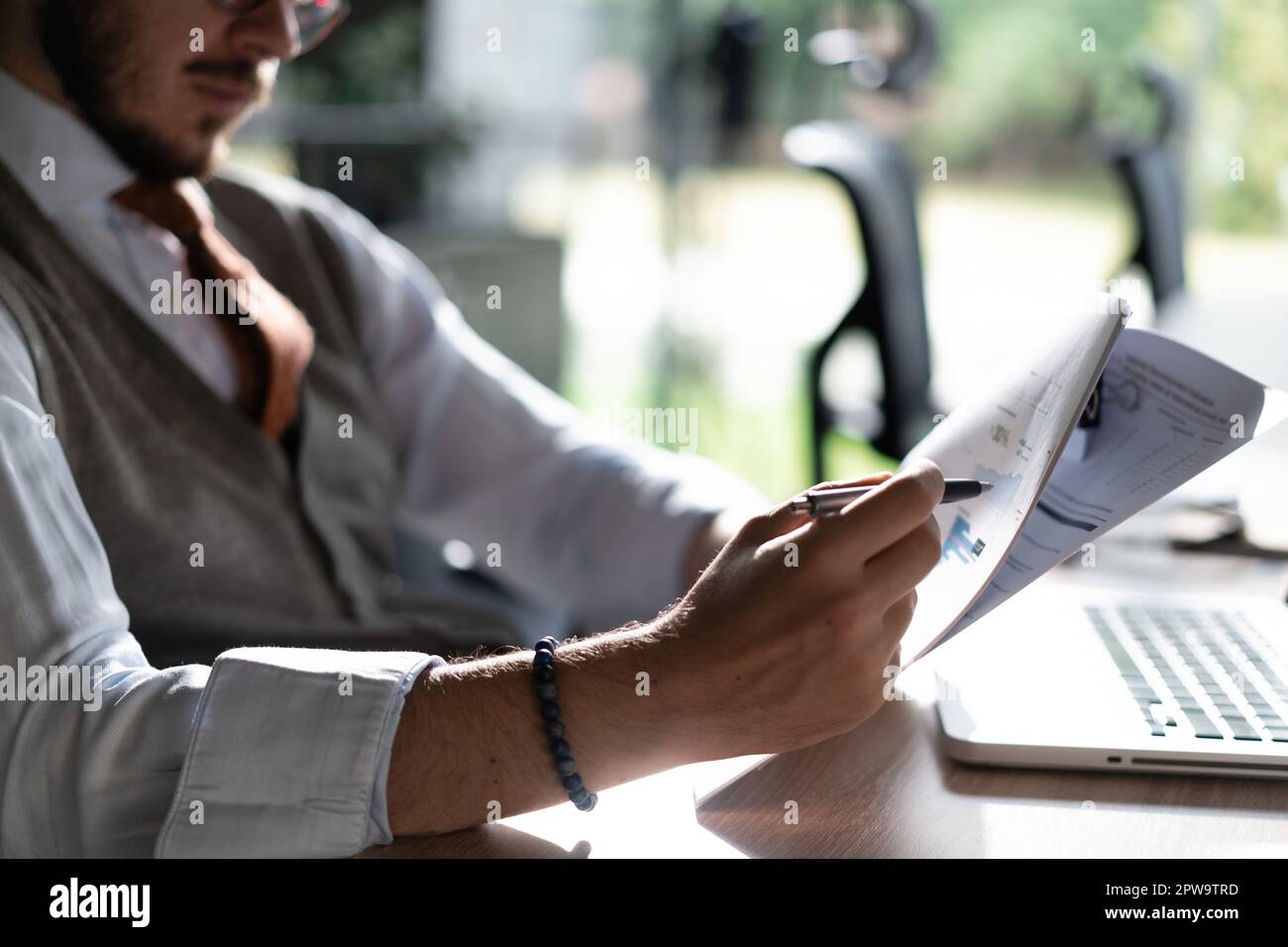 Satisfied lawyer reading paper documents hi-res stock photography and ...