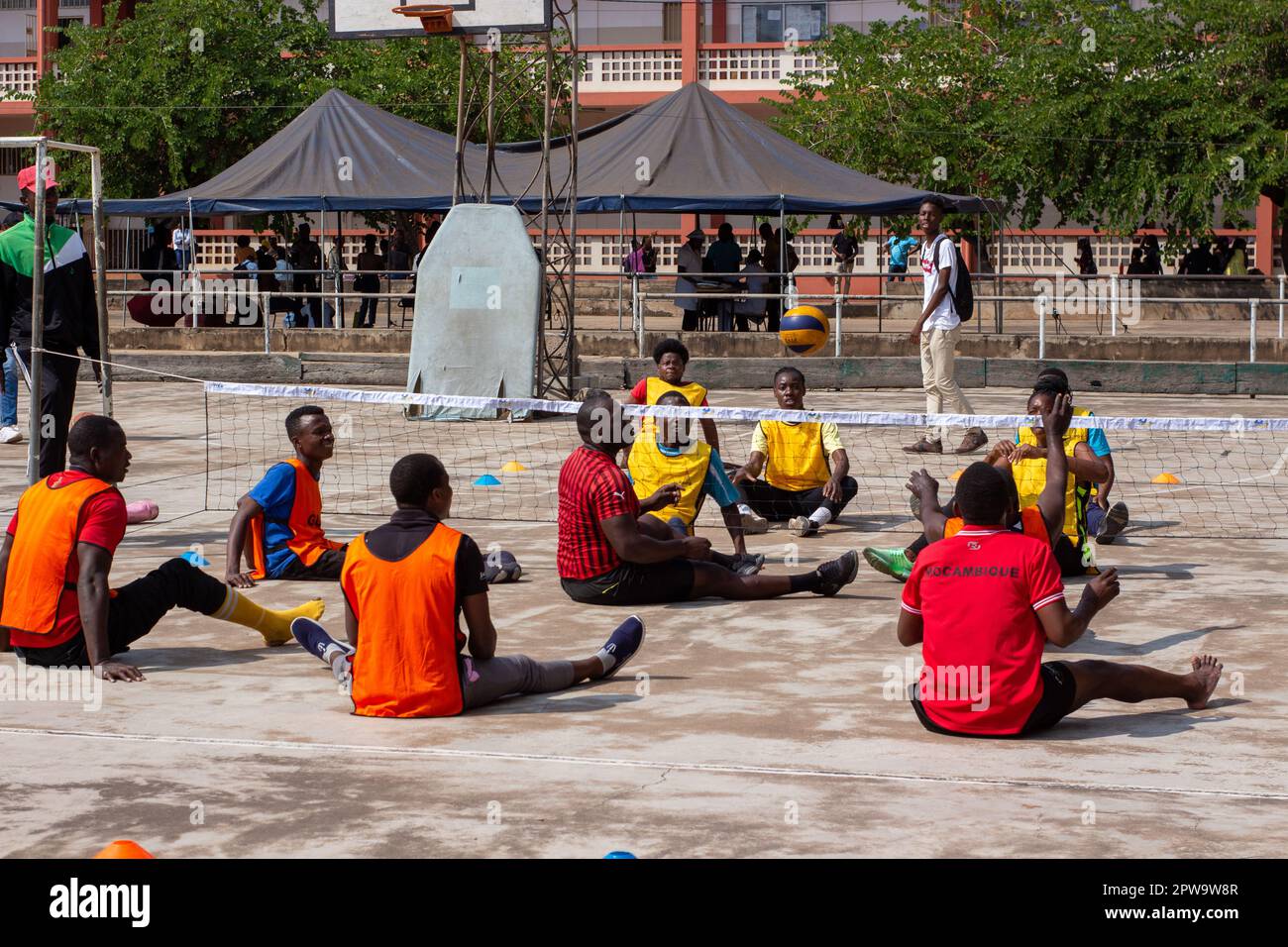 Amateur athletes playing sitting volleyball, a form of volleyball for ...