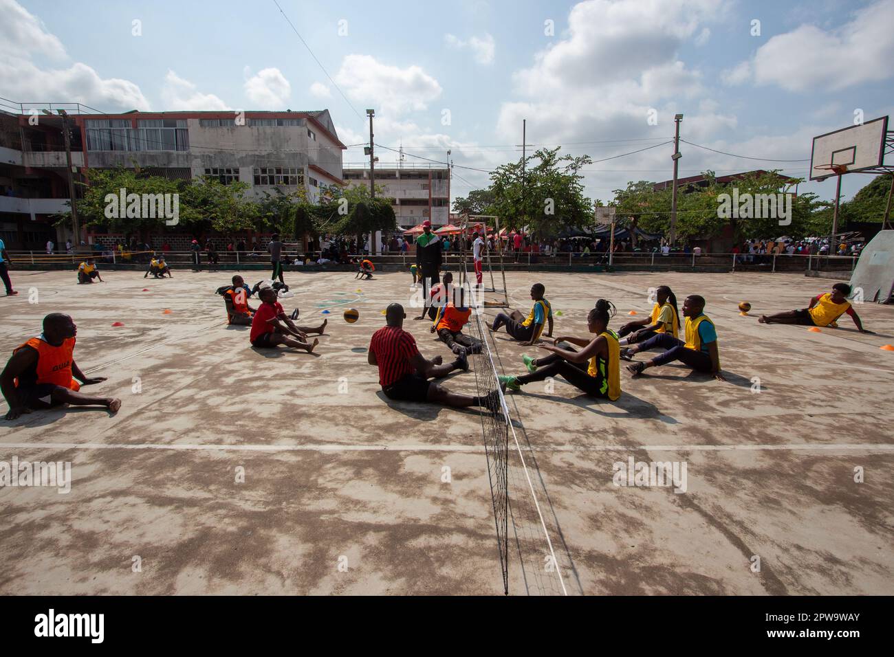 Amateur athletes playing sitting volleyball, a form of volleyball for ...