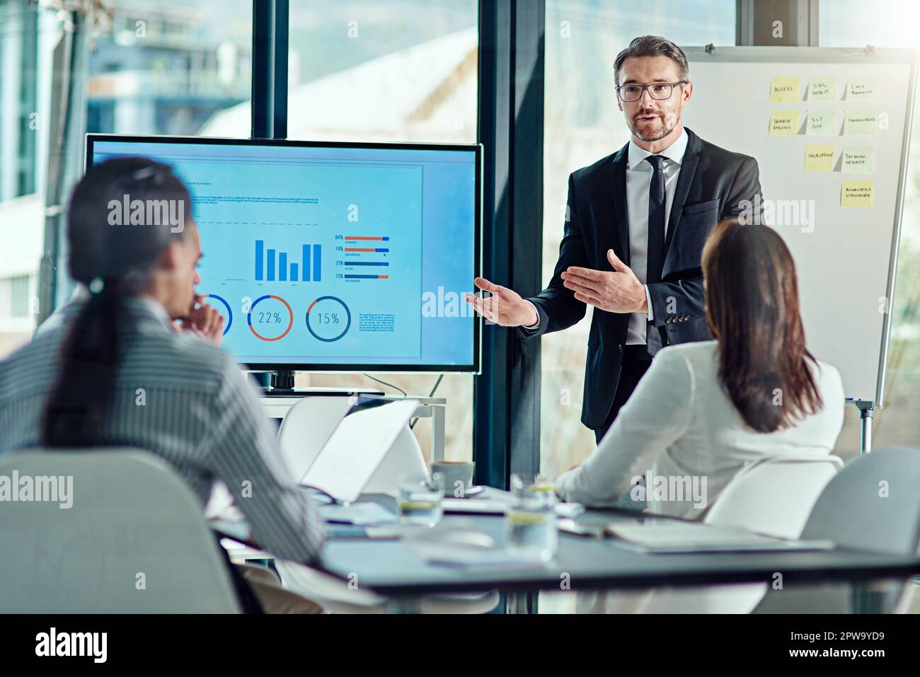 Defining the steps to corporate success. a businessman delivering a ...
