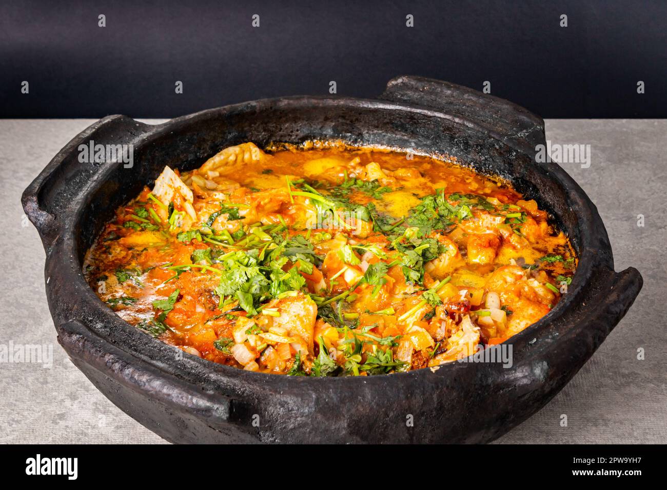 Delicious Brazilian fish moqueca with tomato, onion, olive oil ...